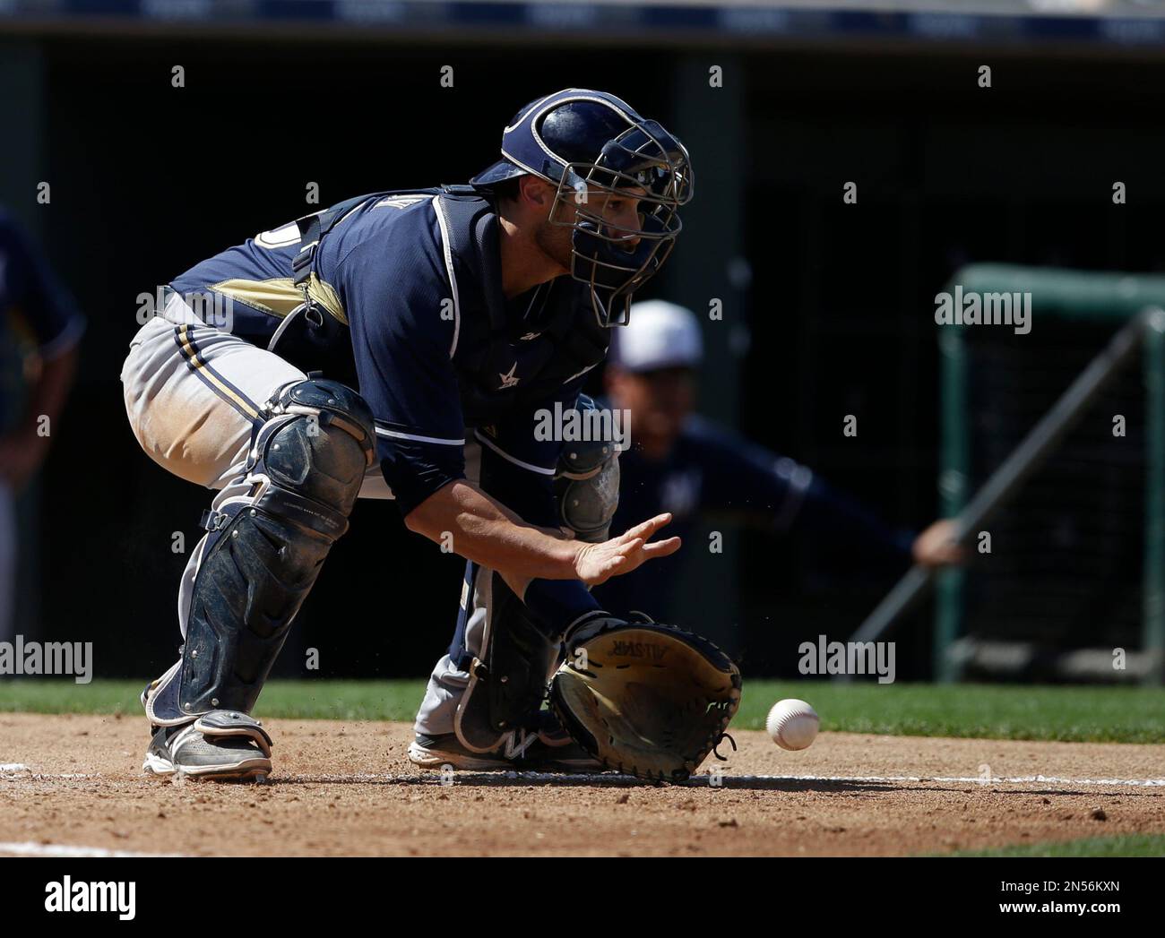 Milwaukee Brewers catcher Jonathan Lucroy makes a catch during a spring ...