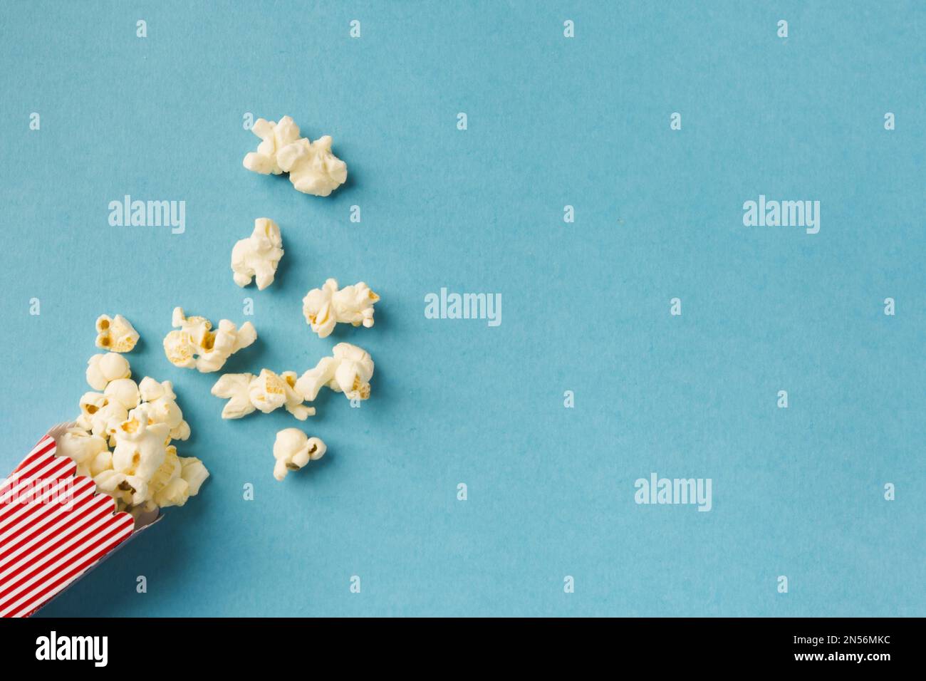 top view popcorn composition blue background with copy space ...