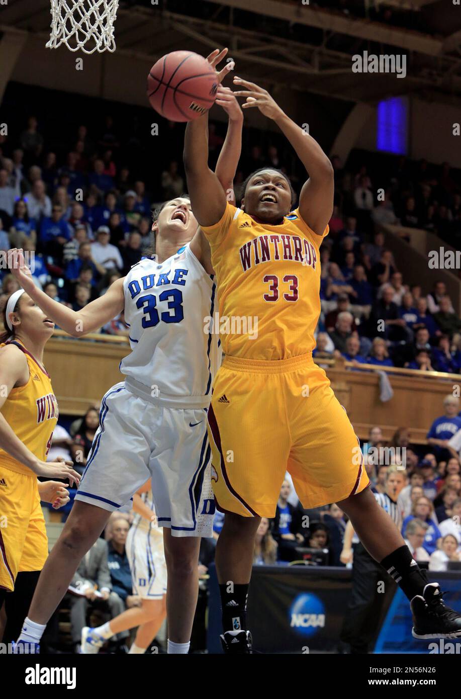 Duke's Haley Peters, left, fights for a rebound with Winthrop's Erica ...