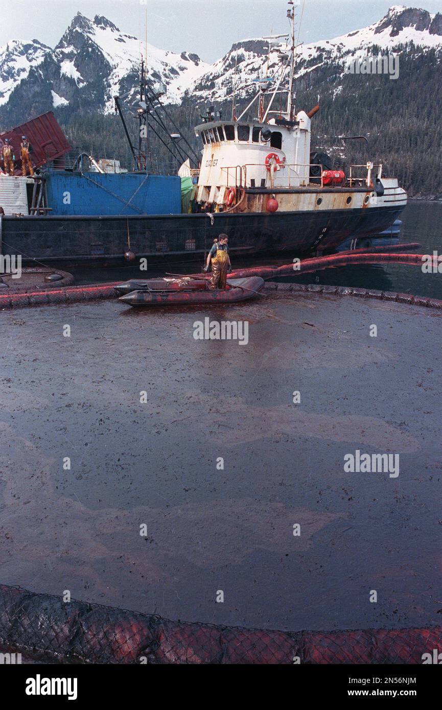 FILE - In this April 16, 1989, file photo, a clean-up worker rakes ...
