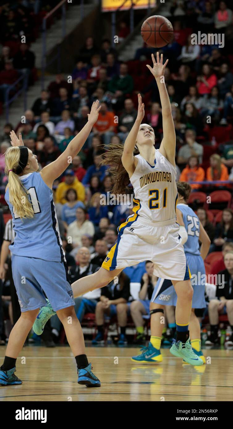 Mukwonago's Ellie Michalski shoots as Superior's Jessica Lindstrom ...