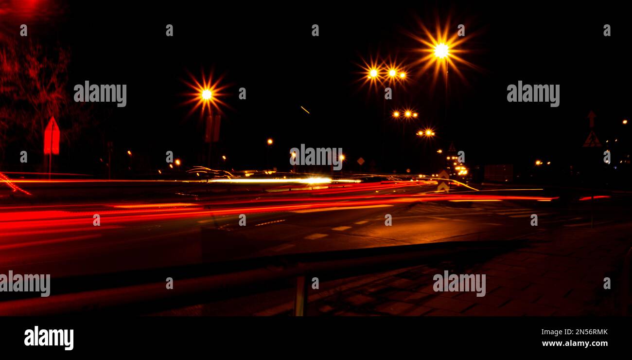 Lights of cars at night. Street line lights. Night highway city. Long ...