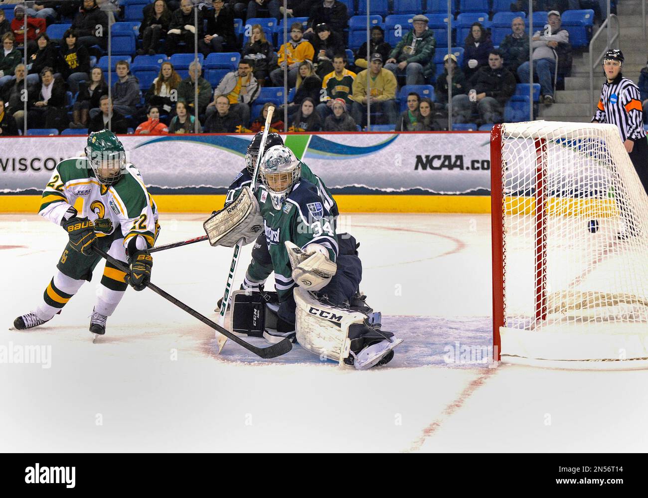 Clarkson's Christine Lambert, left, watches her shot go past Mercyhurst ...