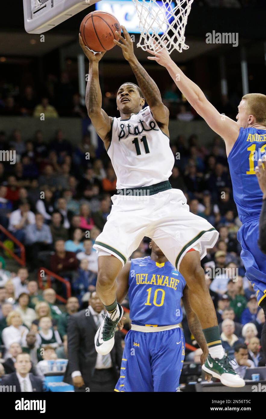 Michigan State's Keith Appling shoots against Delaware in the second ...