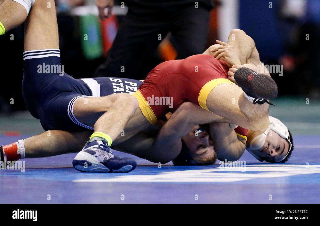 Penn Stte's David Taylor, rear, wrestles Iowa State's Michael Moreno in ...