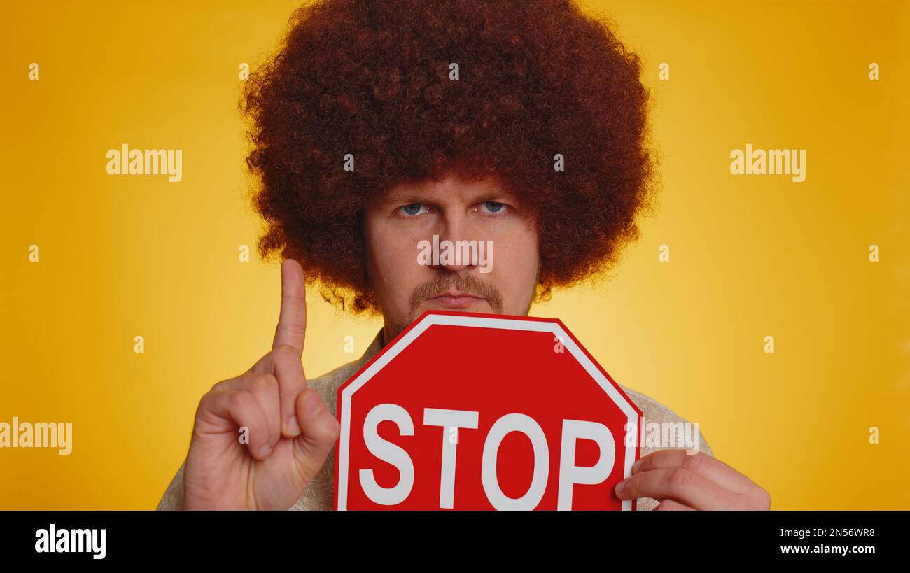 No stop. Serious man say No, hold inscription text red No stop danger ...