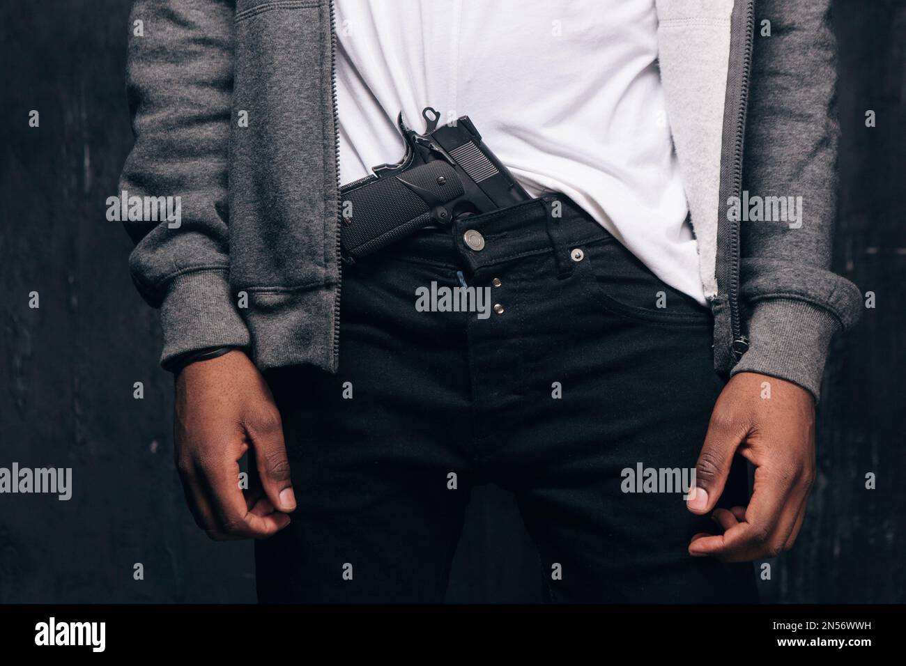 Unrecognizable armed black criminal man hi-res stock photography and ...