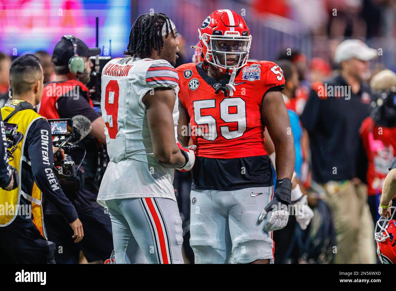 December 31, 2022: Ohio State's Zach Harrison (9) congratulates Georgia ...