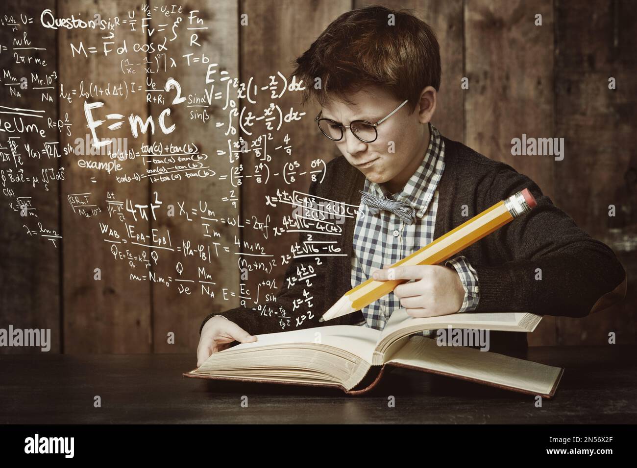 Hmm, this is a tricky problem...a young boy doing his maths homework ...