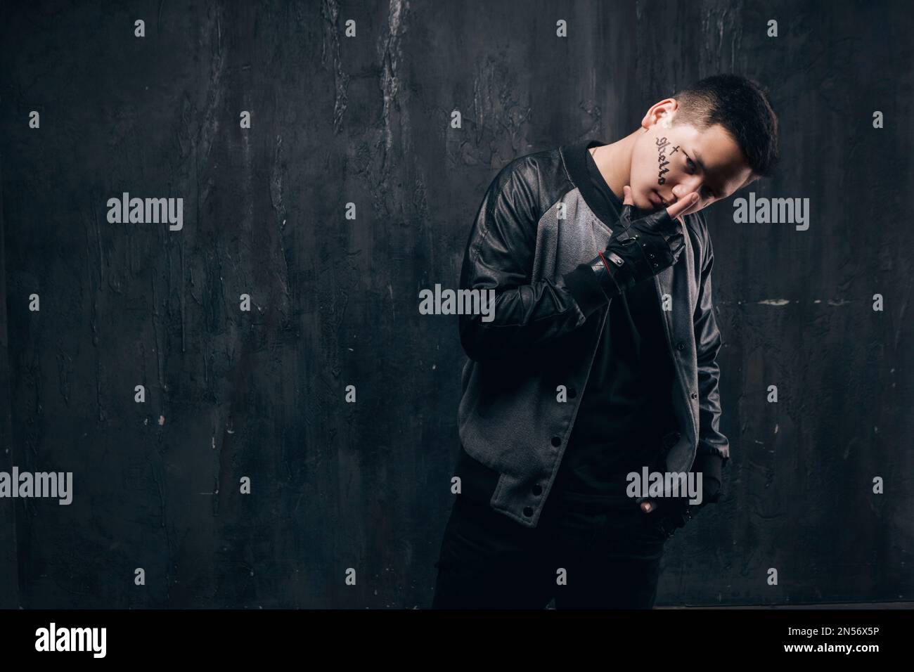 Dangerous tattooed ghetto gang member man Stock Photo - Alamy