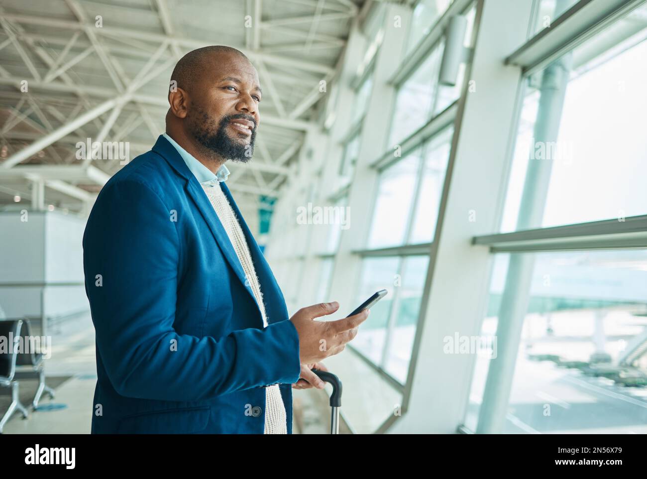 Black man, phone and thinking at airport window for business travel ...