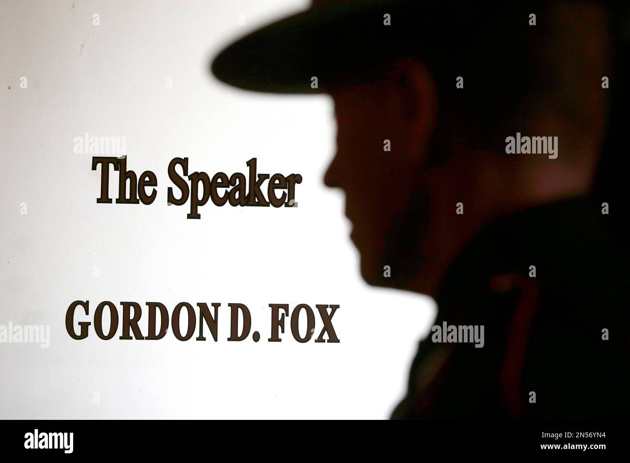 A Rhode Island state police officer stands guard outside the office of ...