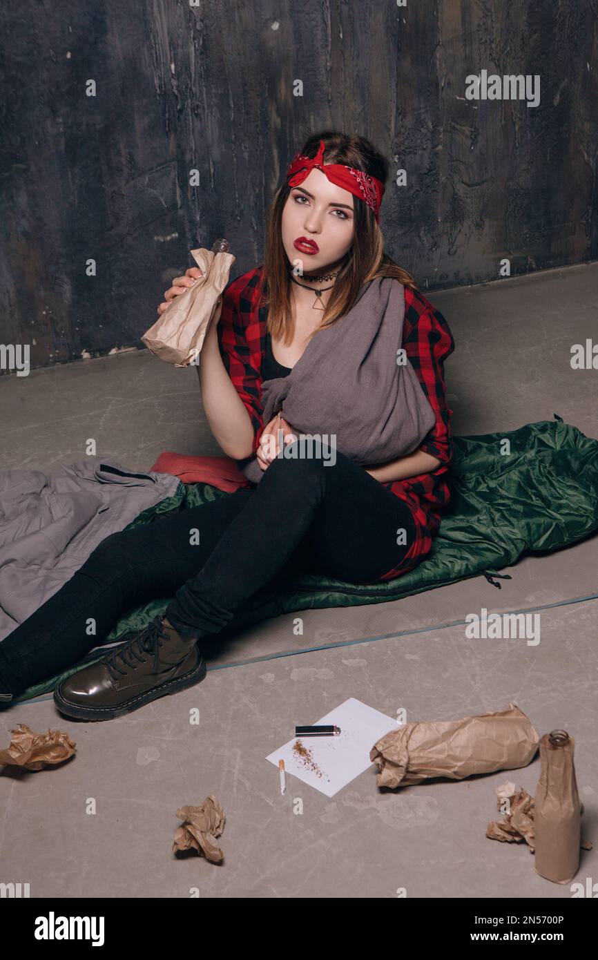 Poor alcoholic girl get drunk Stock Photo - Alamy