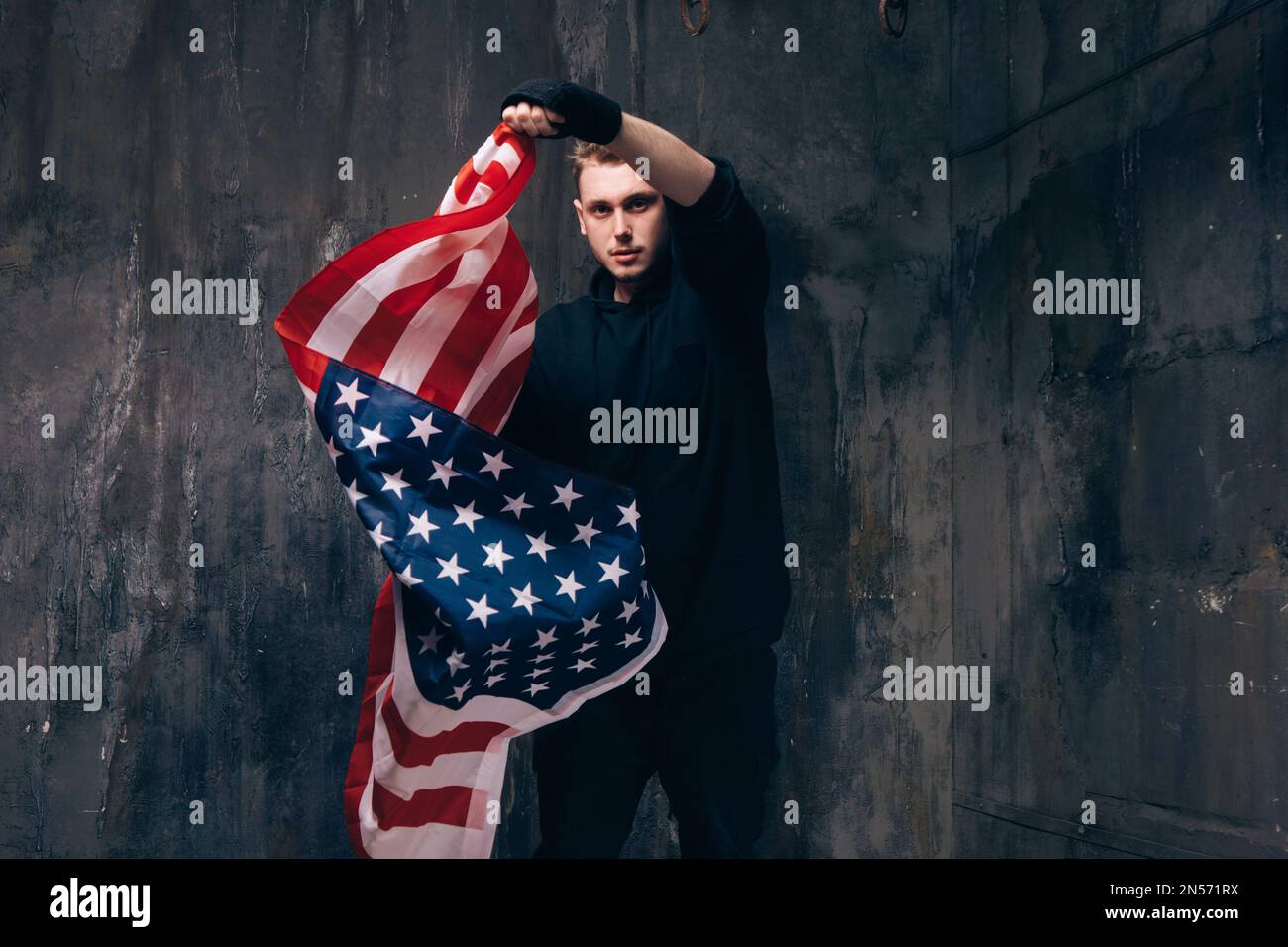 Young USA patriot with flying american flag Stock Photo - Alamy