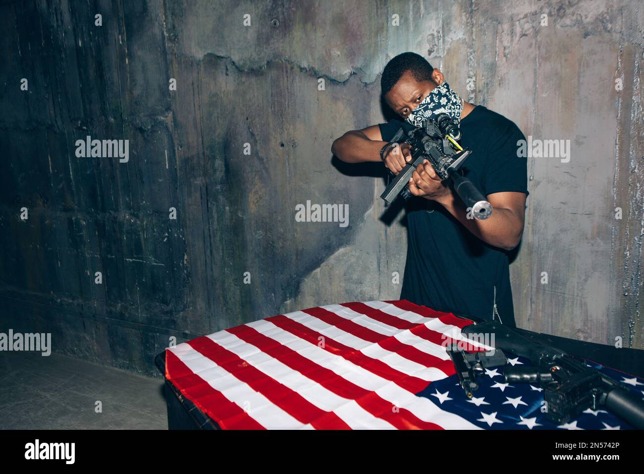 Black soldier checks his weapon Stock Photo - Alamy