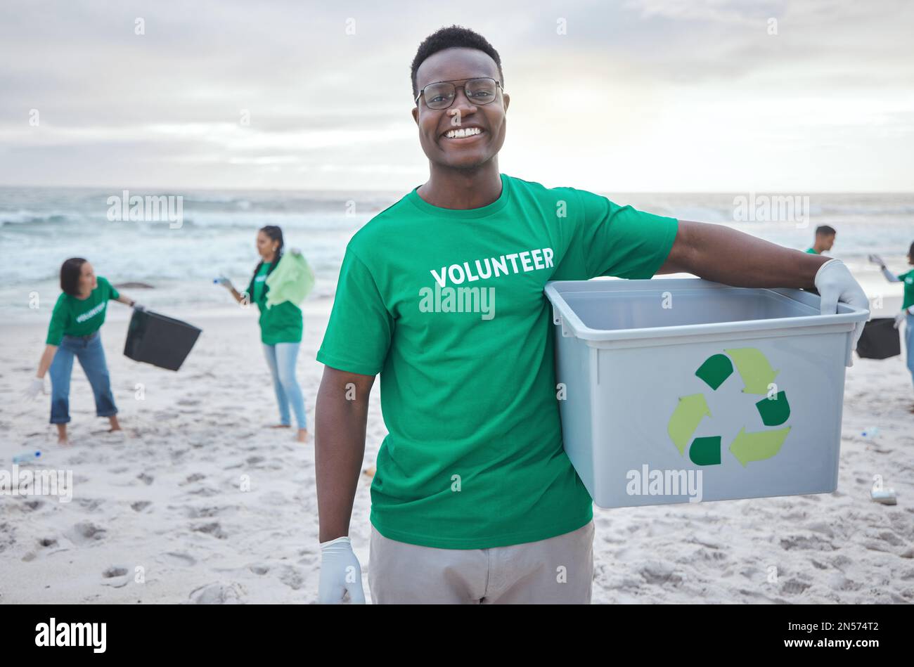 People Recycling On Beach