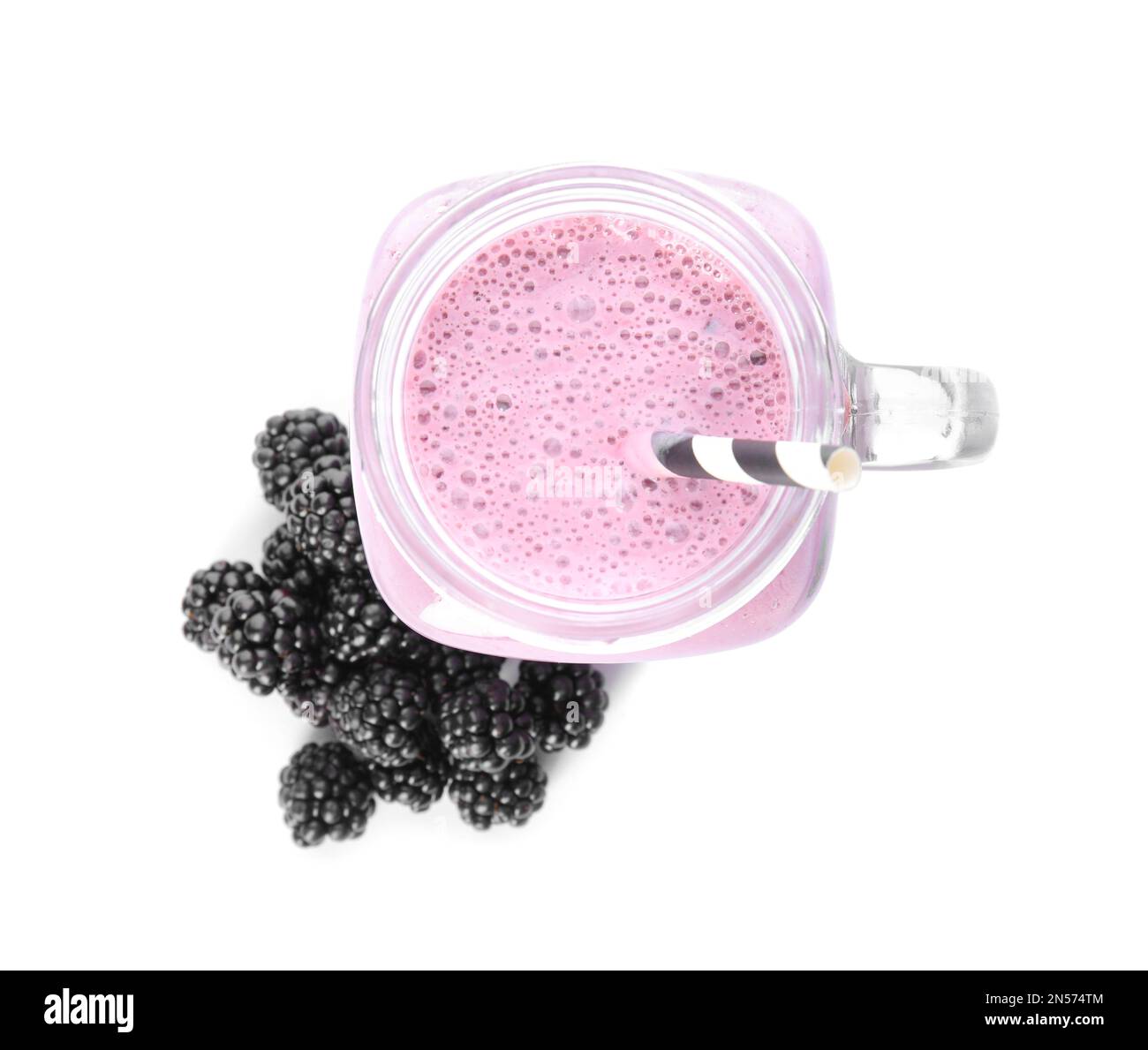 Tasty fresh milk shake with blackberries on white background, top view ...