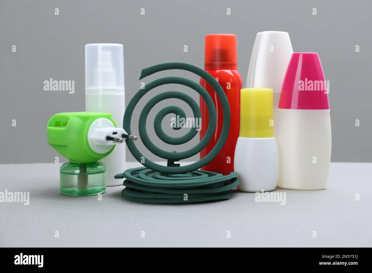 Set of different insect repellents on grey background Stock Photo - Alamy