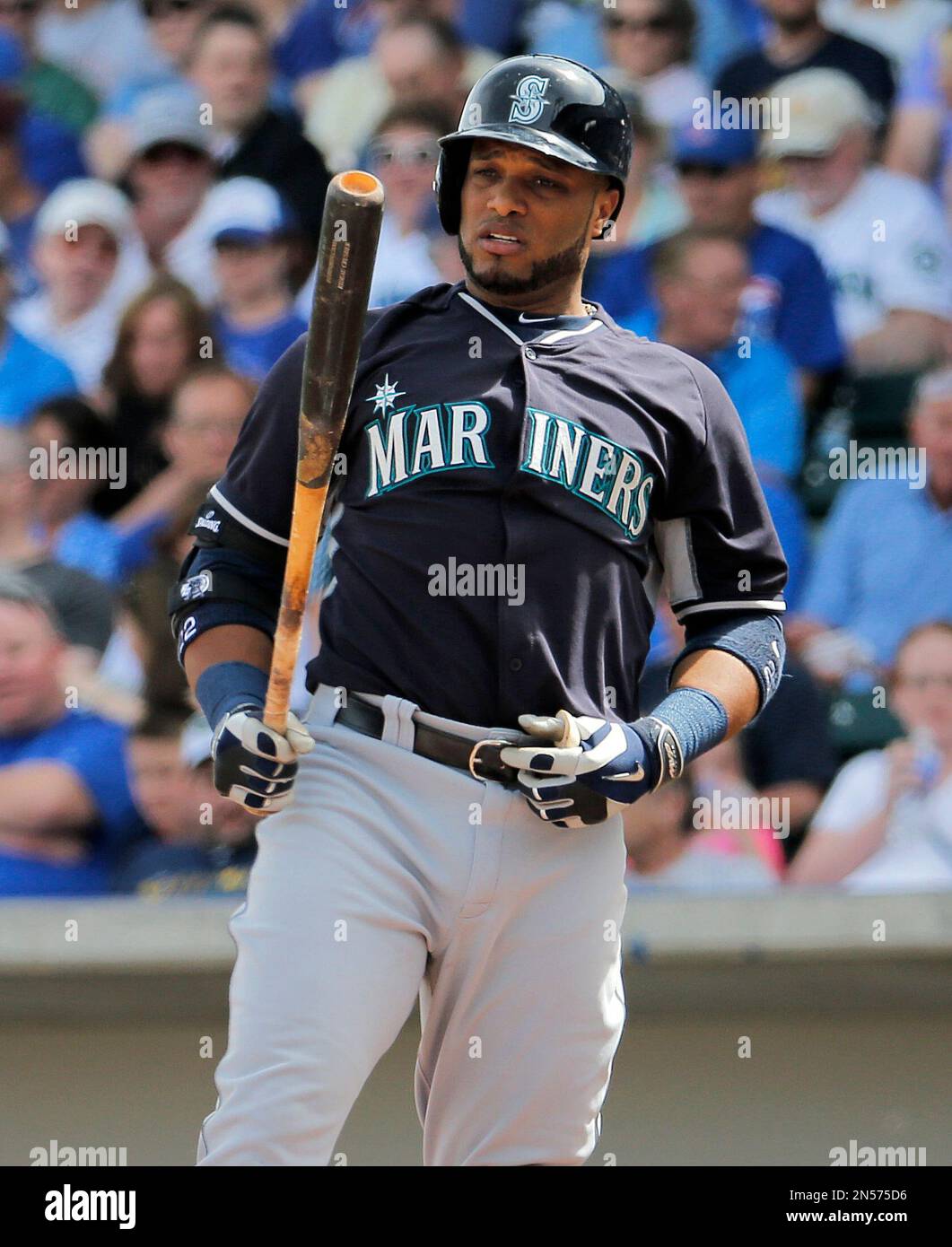 Seattle Mariners' Robinson Cano looks at his bat during the first ...