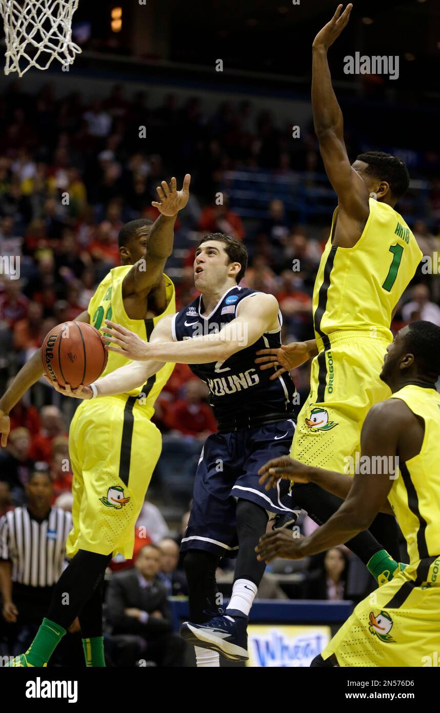 BYU guard Matt Carlino (2) goes to the basket against Oregon forward ...