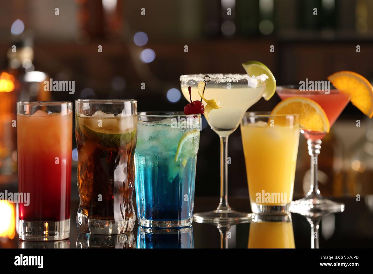 Different delicious cocktails on counter in bar Stock Photo - Alamy