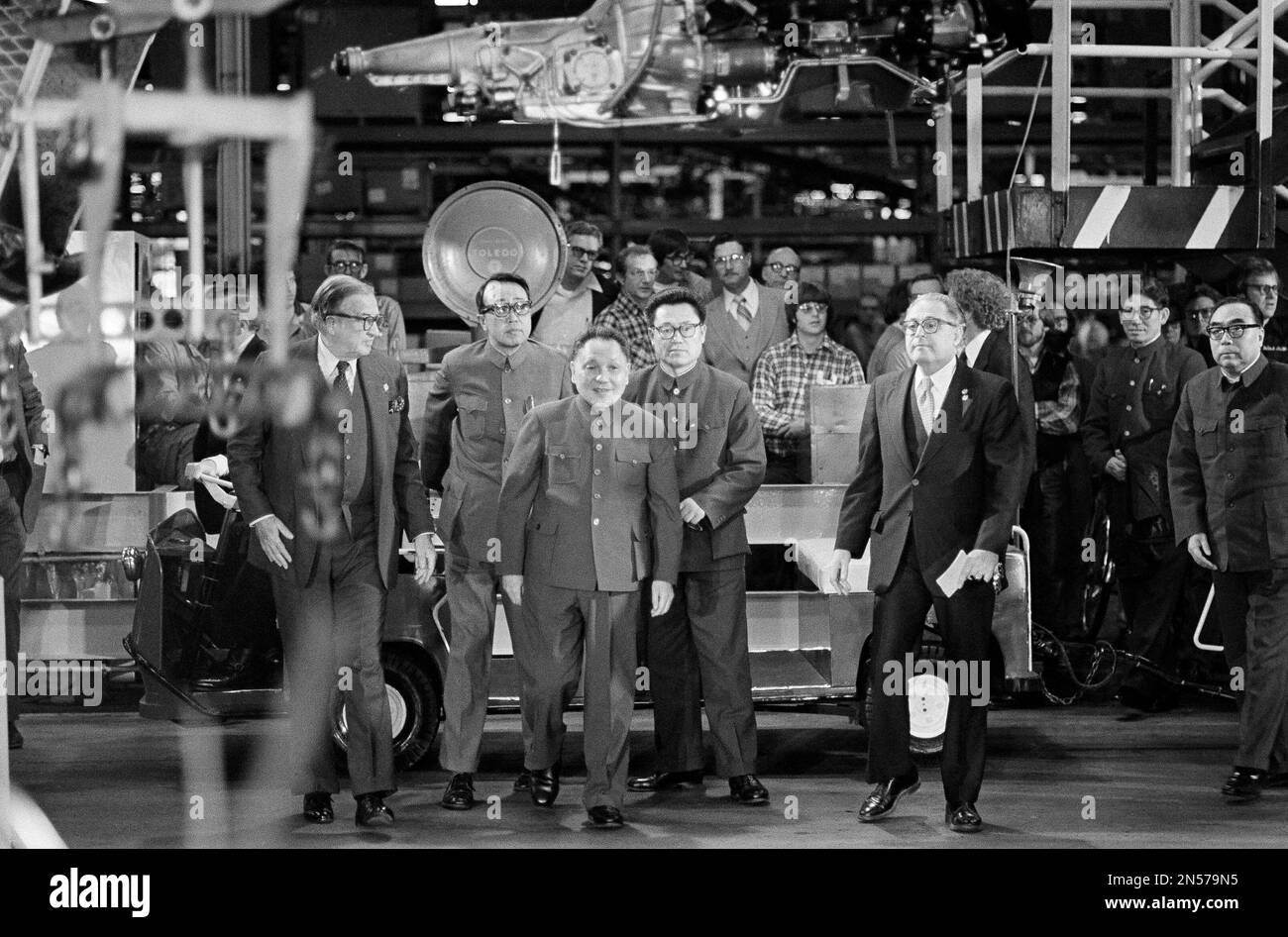 Chinese Vice Premier Teng Hsiao-ping and Henry Ford II walk toward a ...