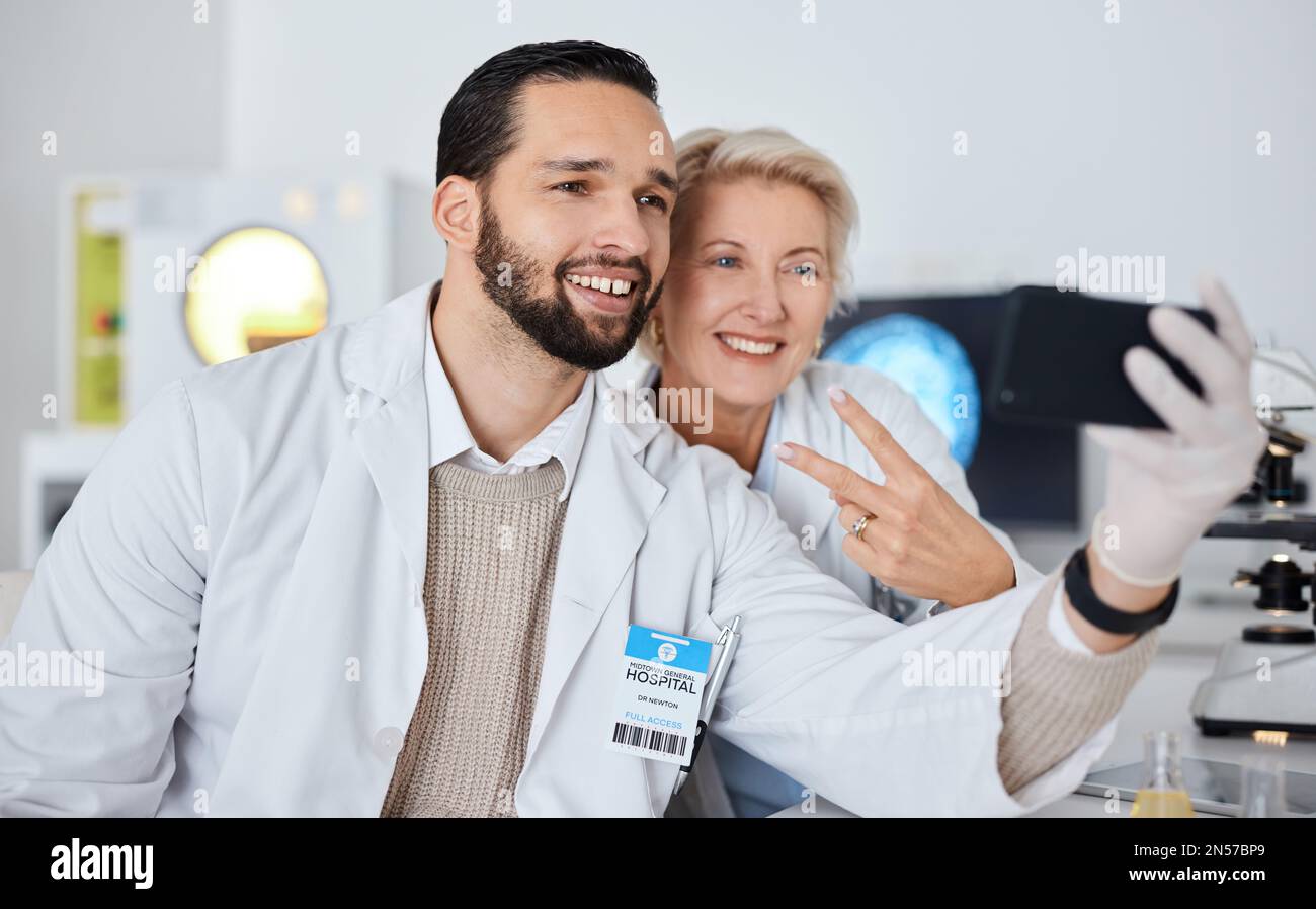 Science team, selfie and smile in lab for research, peace sign and ...