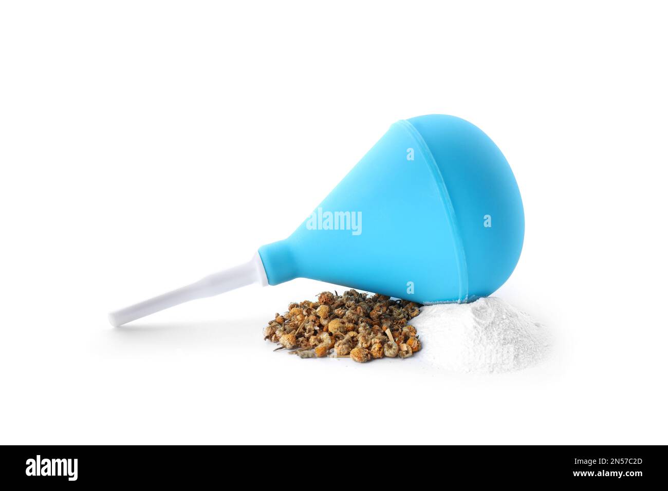 Blue enema, soda powder and dry chamomile flowers on white background ...