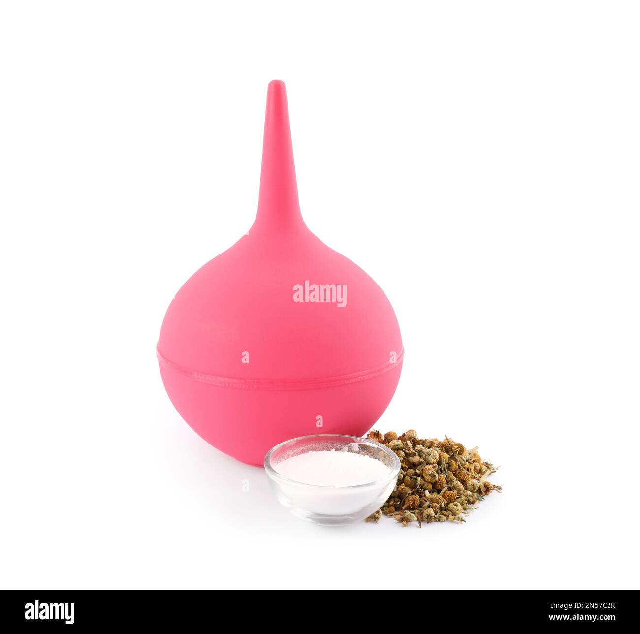 Pink enema, soda powder and dry chamomile flowers on white background ...
