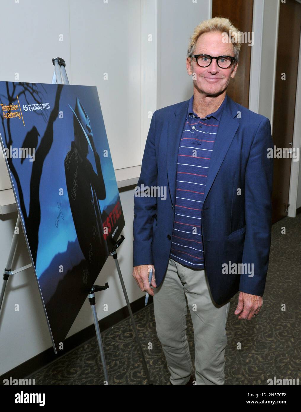 Jere Burns signs a poster at "An Evening with Justified," on Wednesday ...