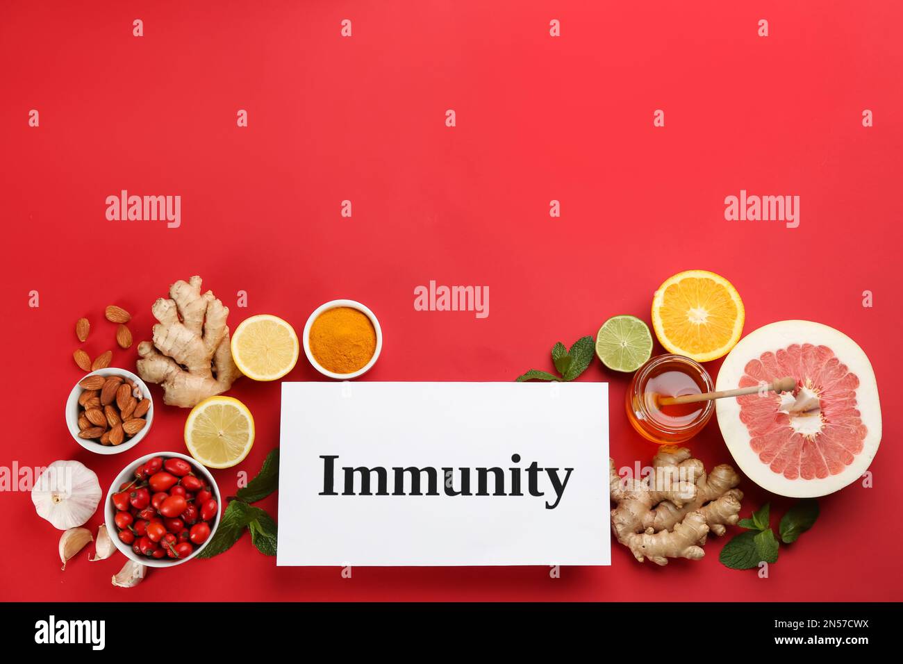 Set of natural products and card with word Immunity on red background ...