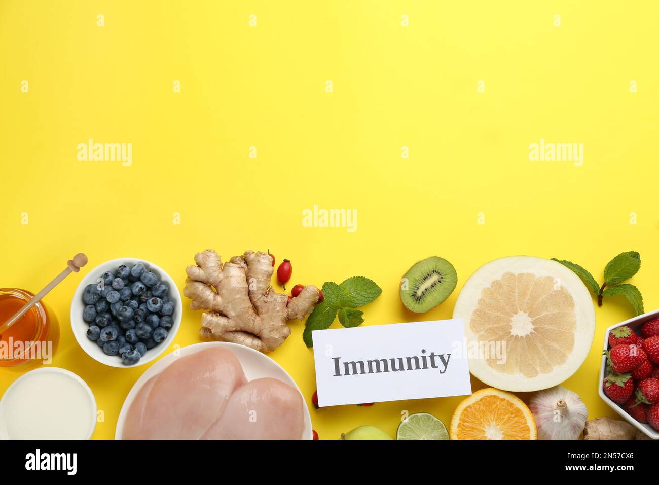 Set of natural products and card with word Immunity on yellow ...
