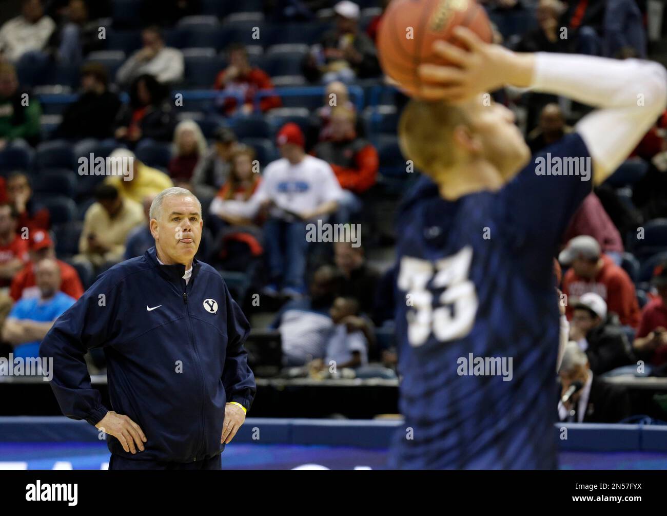 BYU head coach Dave Rose, left, watches as forward Nate Austin shoots ...