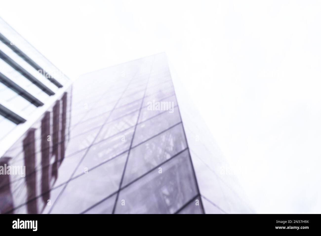 blurry image of city buildings made of glass and concrete Stock Photo ...