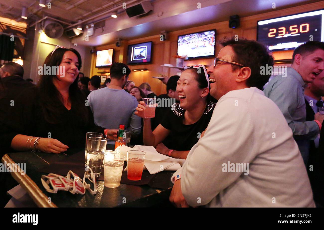 Guests enjoy Stoli® drinks while waiting for Manhattan bartender ...