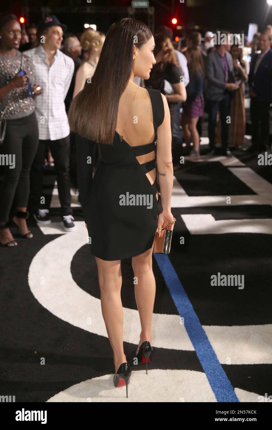 Maggie Q arrives at the world premiere of "Divergent" at the Regency ...