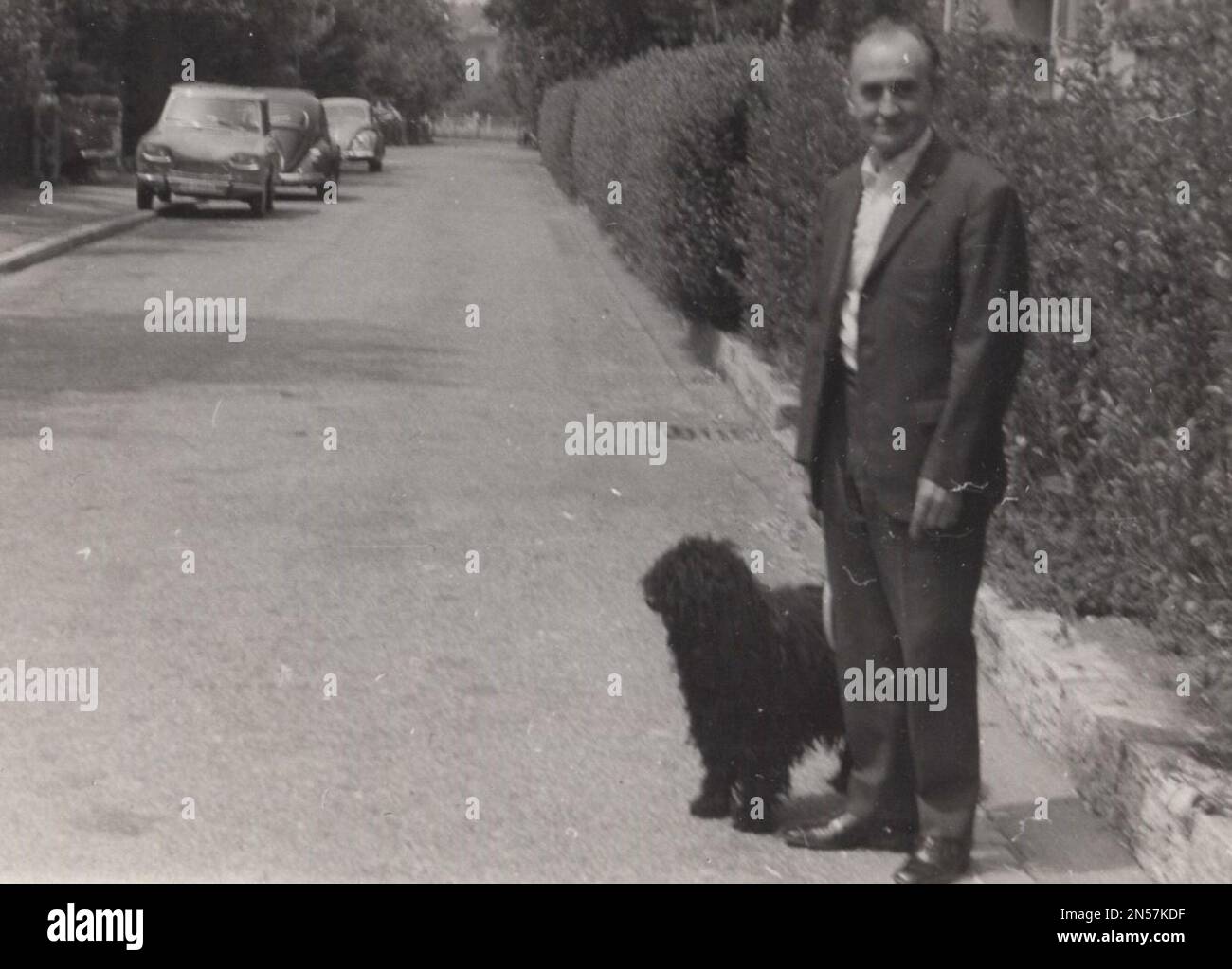 Vintage Photograph about pet dogs : proud man standing with his clever ...