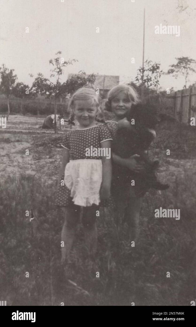 Vintage Photograph of a young Girl and her pet Dog / hand holding puppy ...