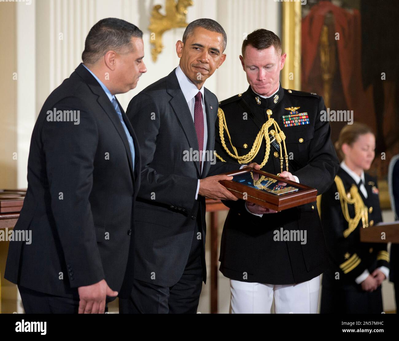 Richard Conde stands with President Barack Obama before accepting the ...