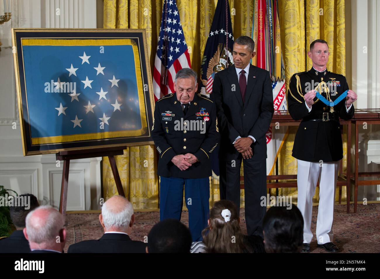 Sgt. First Class Jose Rodela, left, stands with President Barack Obama ...