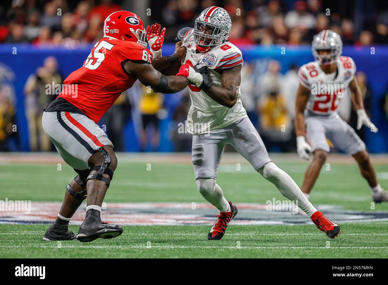 December 31, 2022: Georgia's Amarius Mims (65) tries to hold off the ...