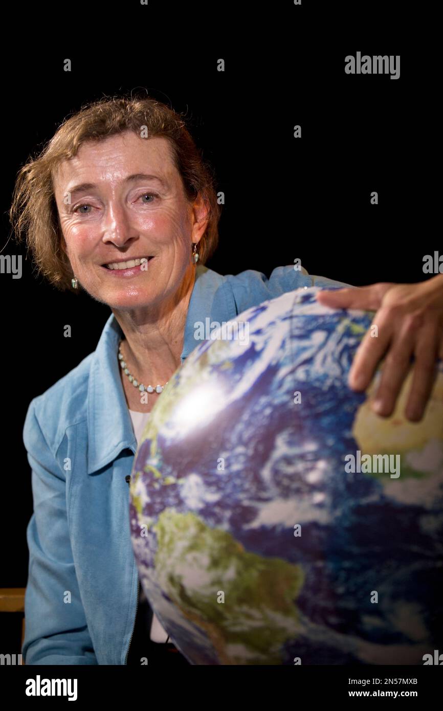 Rutgers University Climate Scientist Jennifer Francis holds a globe of ...