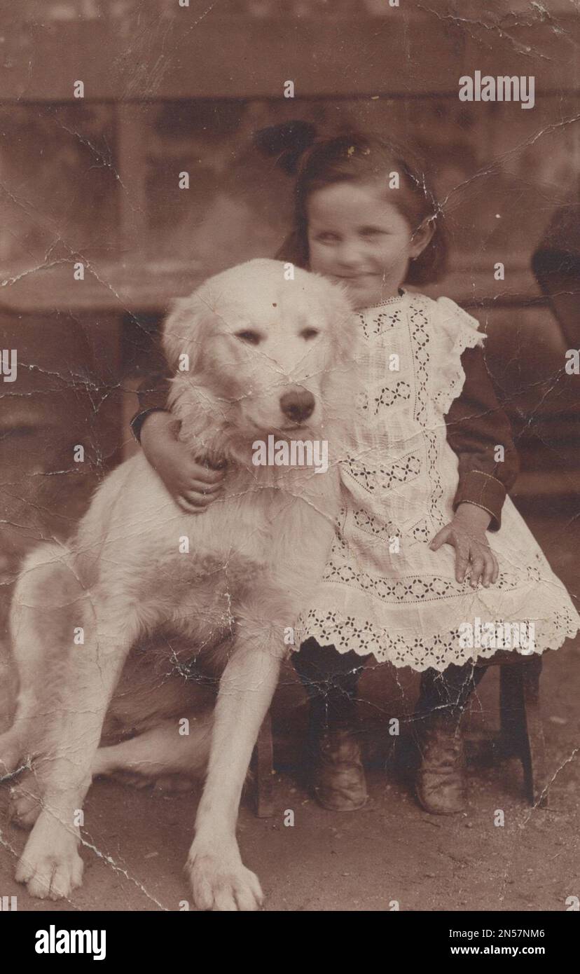 Vintage Photograph of a young Girl and her pet Dog / hand holding puppy ...