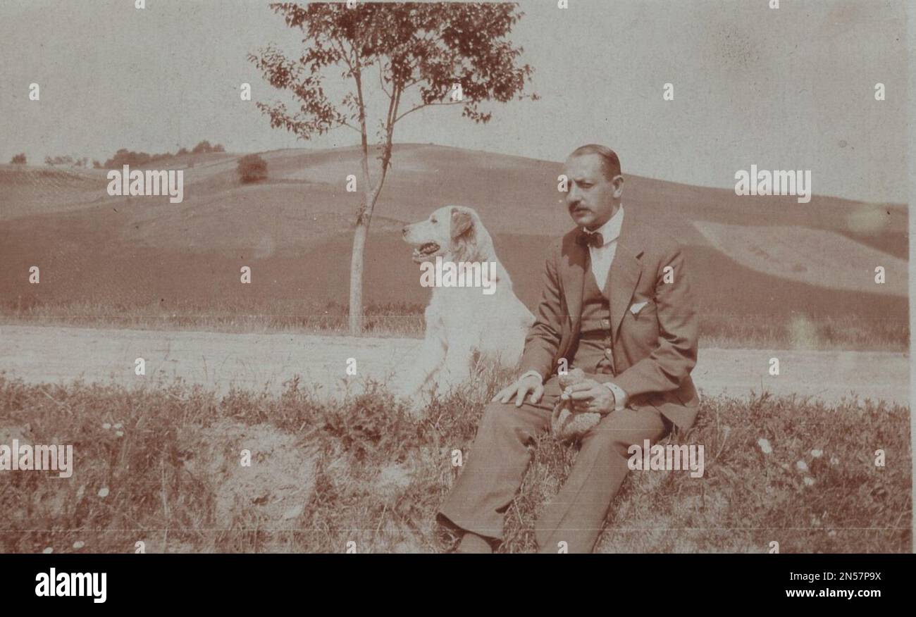 Vintage Photograph about pet dogs : beautiful dog and his owner chill ...
