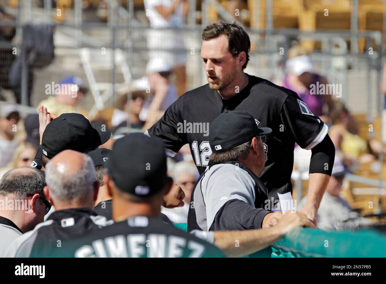 Chicago White Sox's Conor Gillaspie (12) is greeted at the dugout after ...