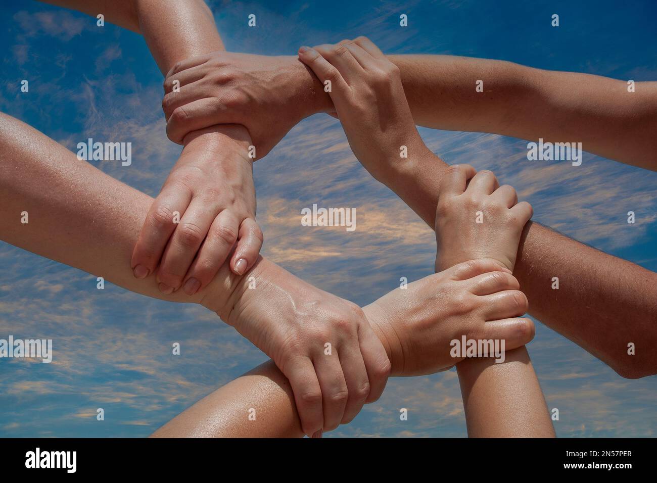 Many hands of people connect or link together community of cooperation ...