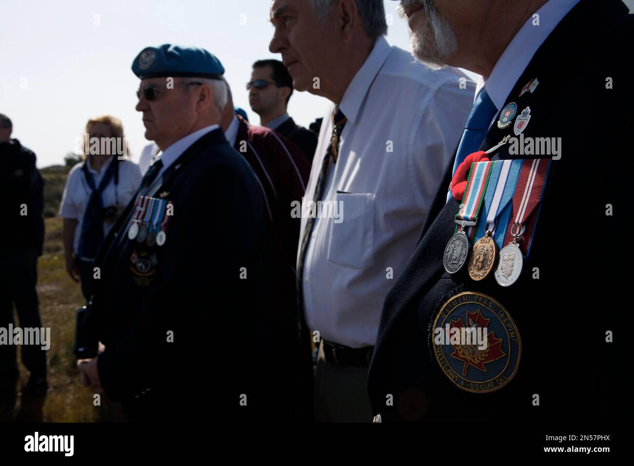 Canadian retired Major General Alain Forand, centre, joined by fellow ...