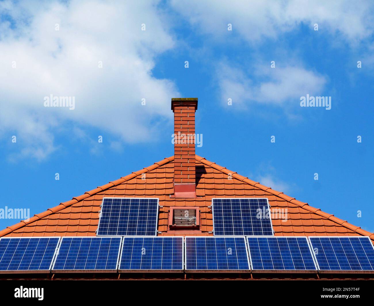 photovoltaic PV sun collector solar panels on sloped clay house roof ...