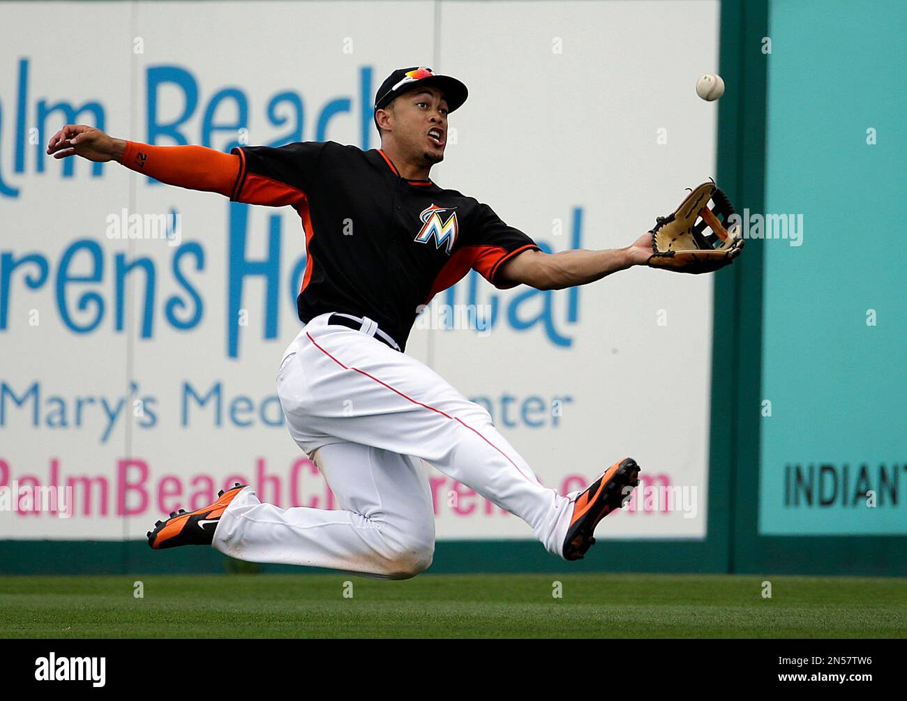 Miami Marlins' Giancarlo Stanton makes a catch for an out on a fly ball ...