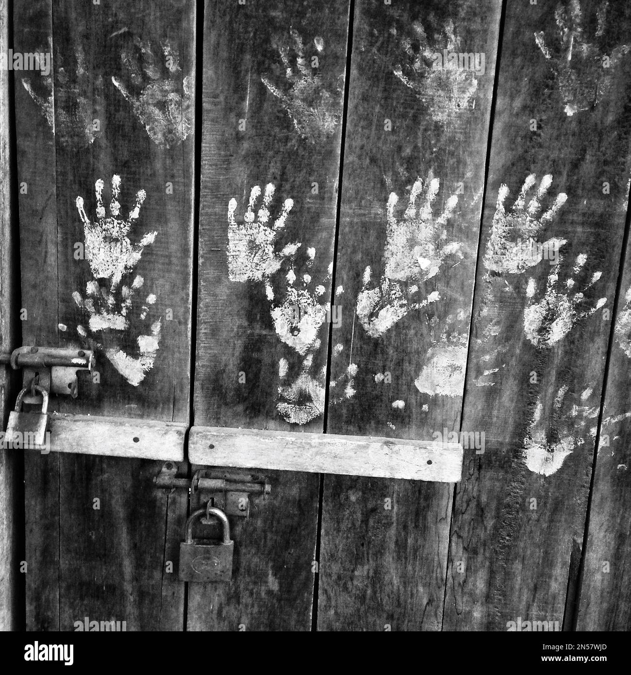 Handprints on a door in Puerto Maldinado, Peru. (David Guttenfelder/AP ...